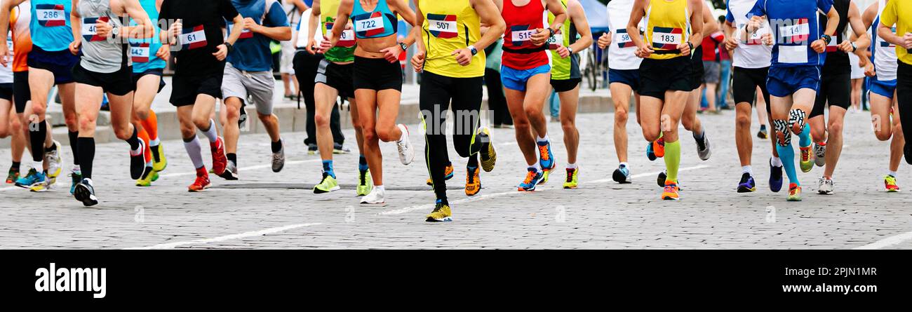 large group male and female runners run marathon, athletes jogging city ...
