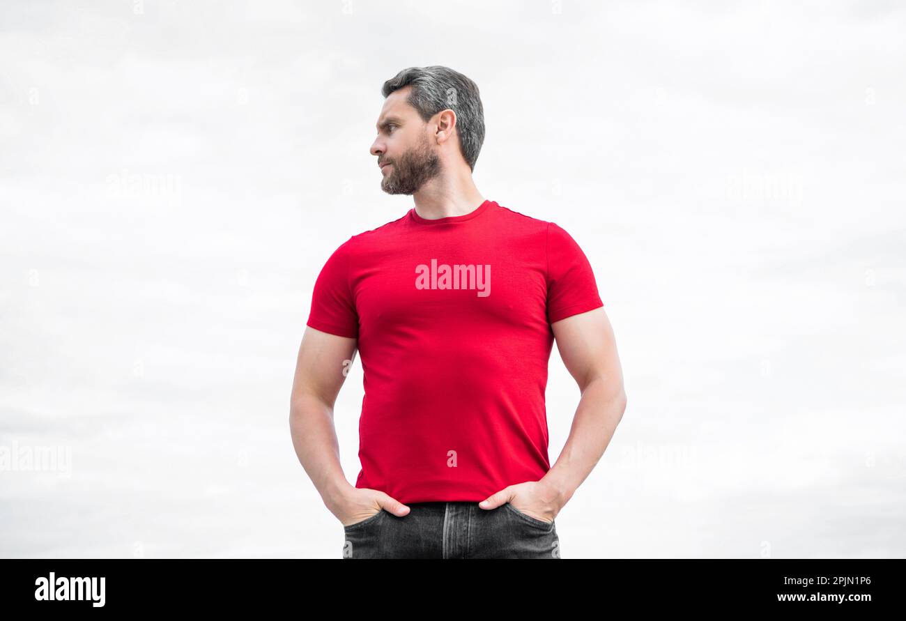 man in red shirt outdoor on sky background Stock Photo - Alamy