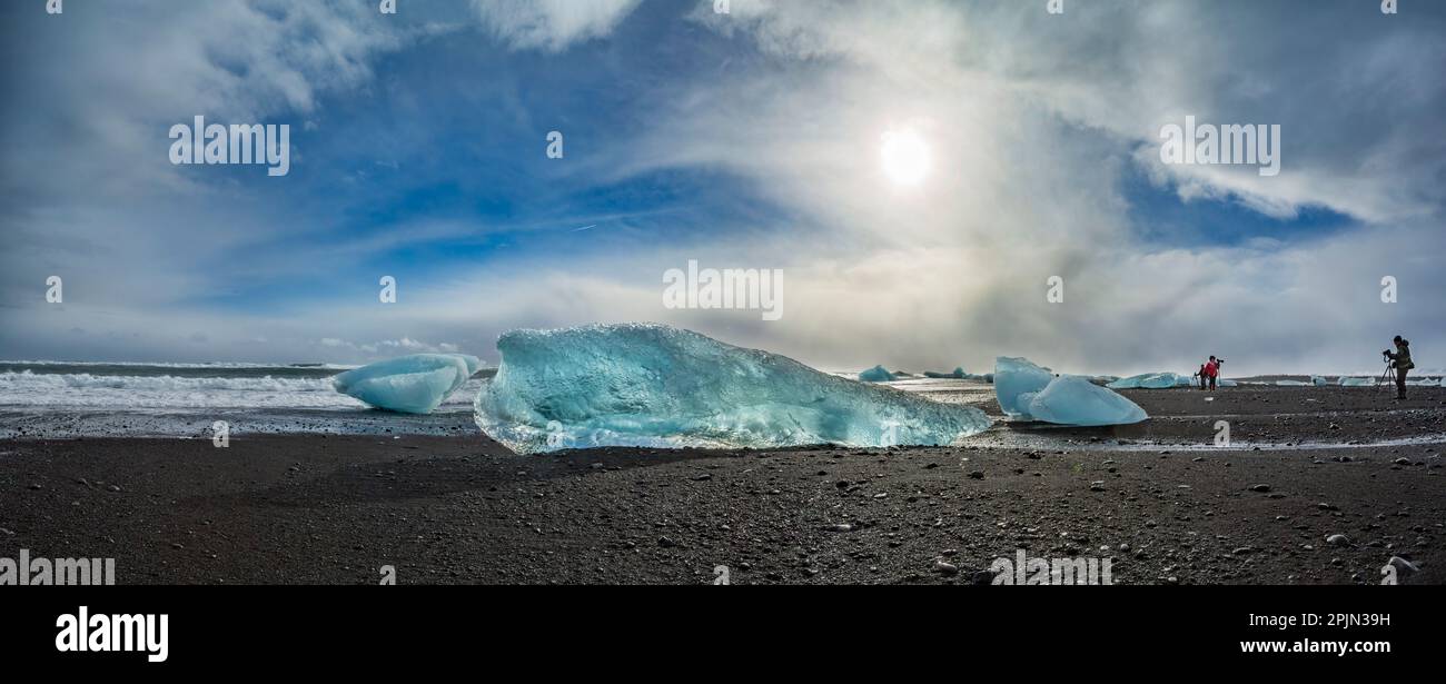 A view of an azure-colored block of ice from an iceberg carried by a ...
