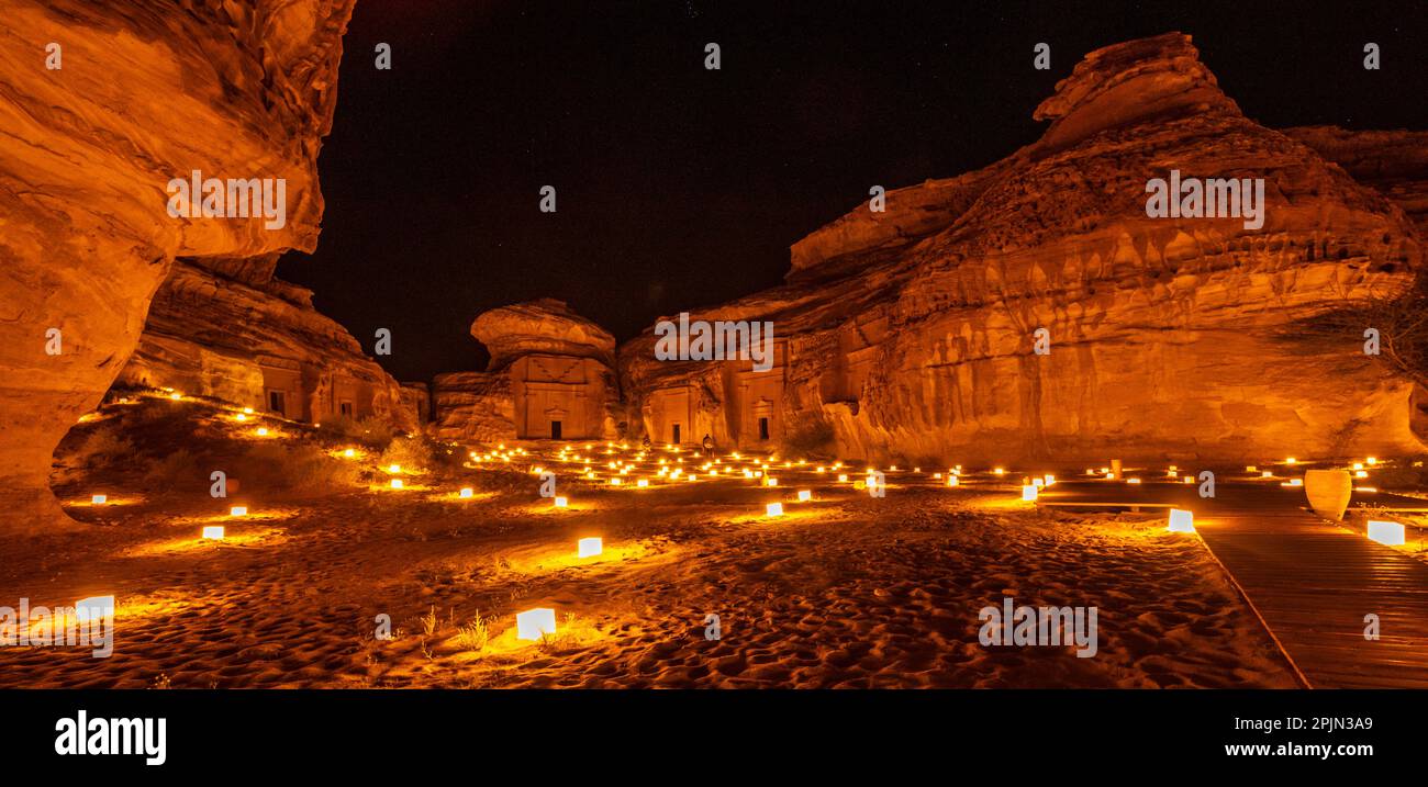 Ancient tombs of Hegra city illuminated during the night panorama, Al ...