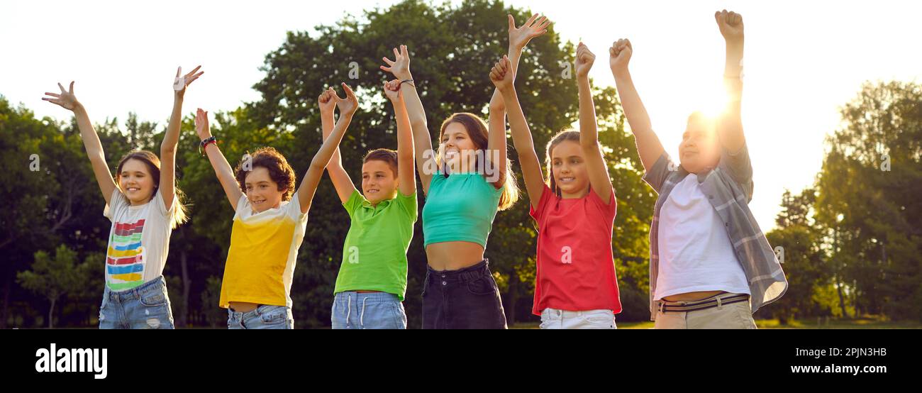 Group of happy little children playing and having fun in park during ...