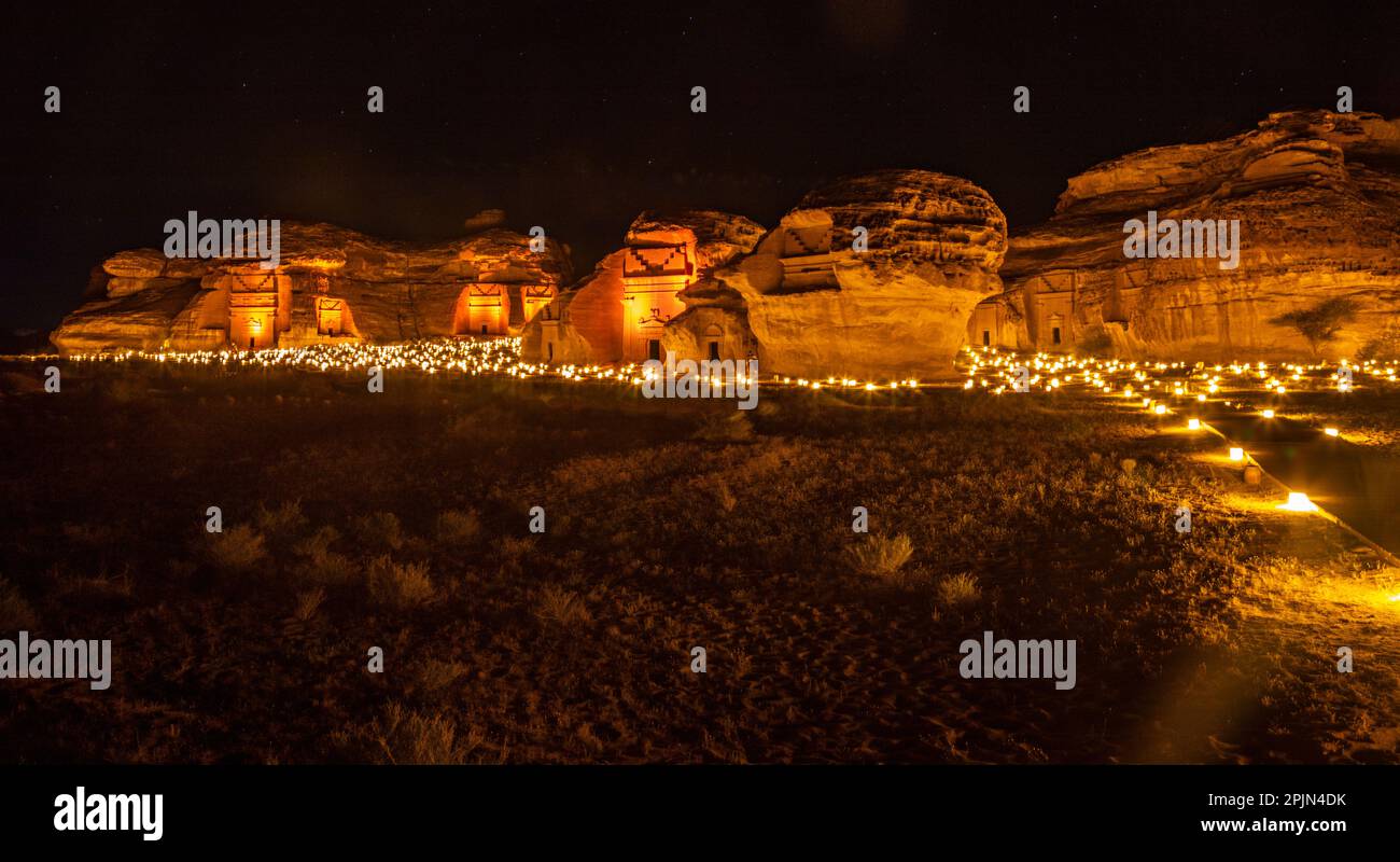 Ancient tombs of Hegra city illuminated during the night panorama, Al ...
