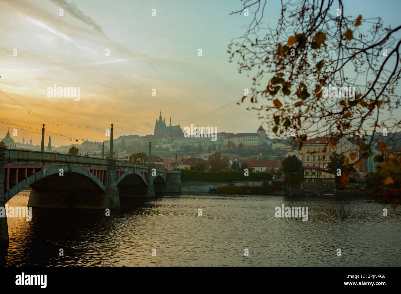 landscape with Vltava river and St. Vitus Cathedral at sunset shotted ...