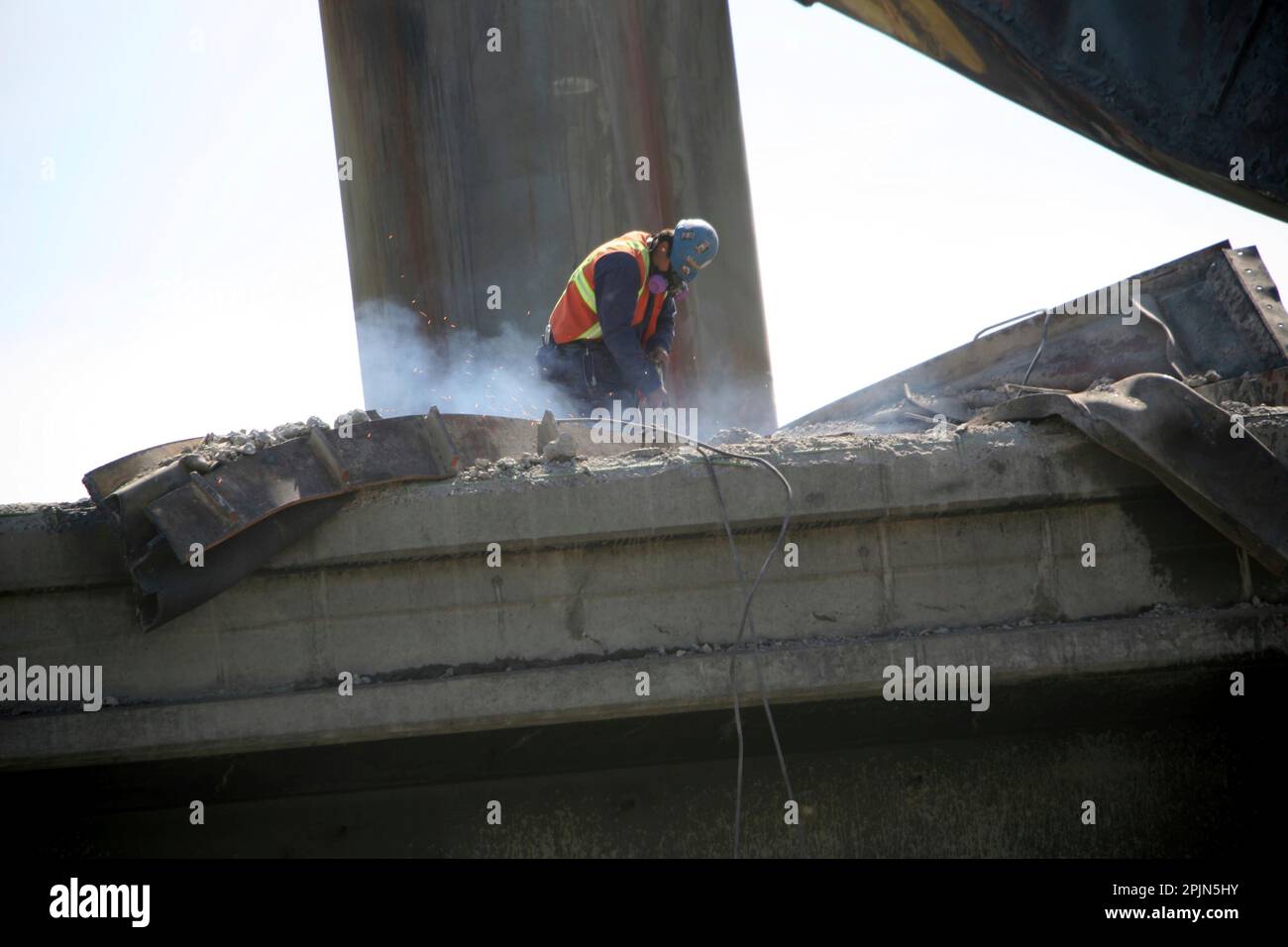 freeway 084 ls.JPG A crew continues demolition work at the site of the ...