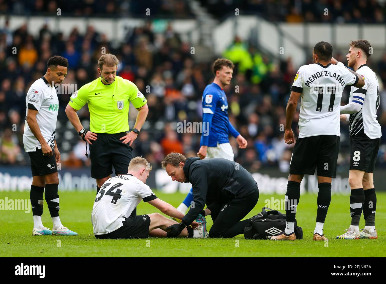 Derby County's Jake Rooney is treated for injury during the Sky Bet ...