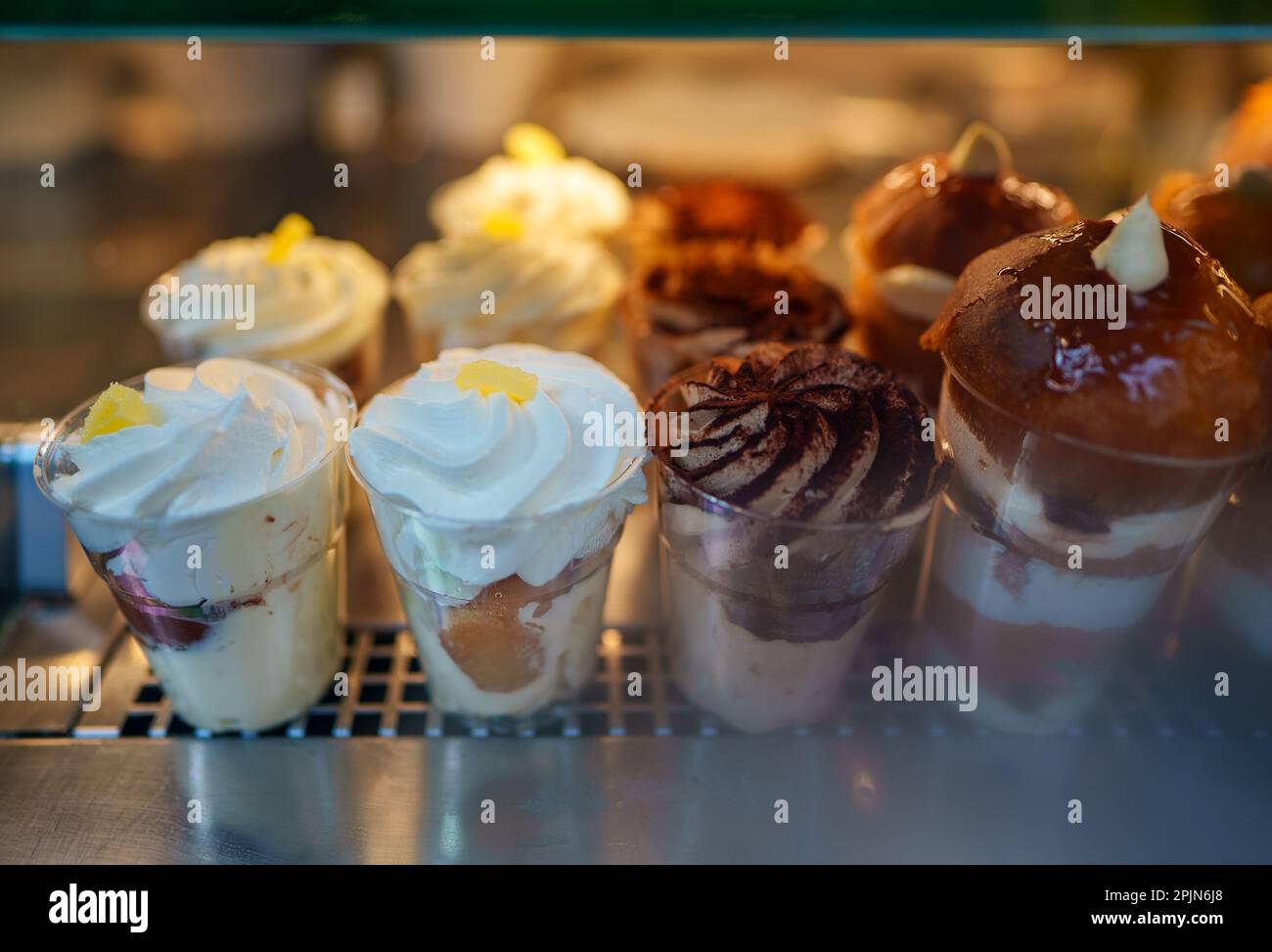 Traditional rum baba and whisped cream italian pastries Stock Photo - Alamy