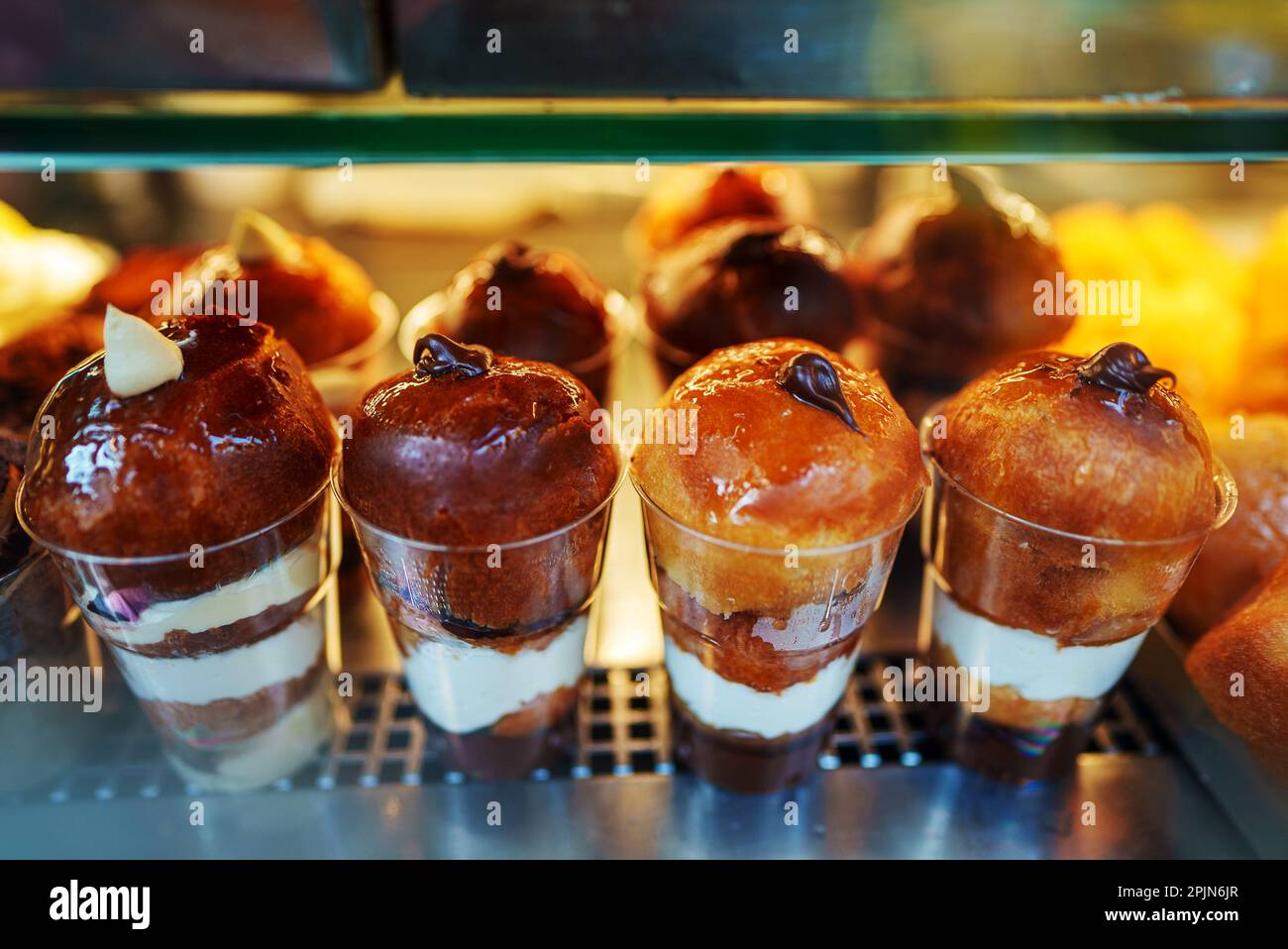 Traditional baba au rhum italian pastries Stock Photo - Alamy