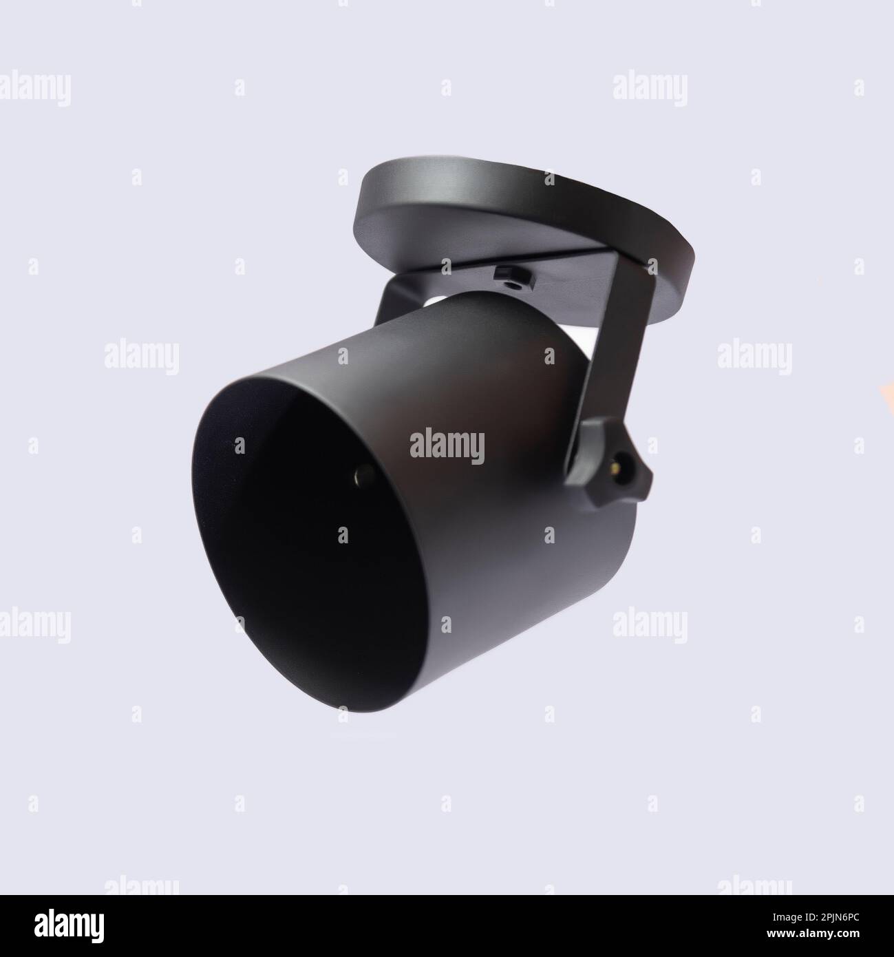 An overhead spotlight with a sleek black finish isolated on the white ...