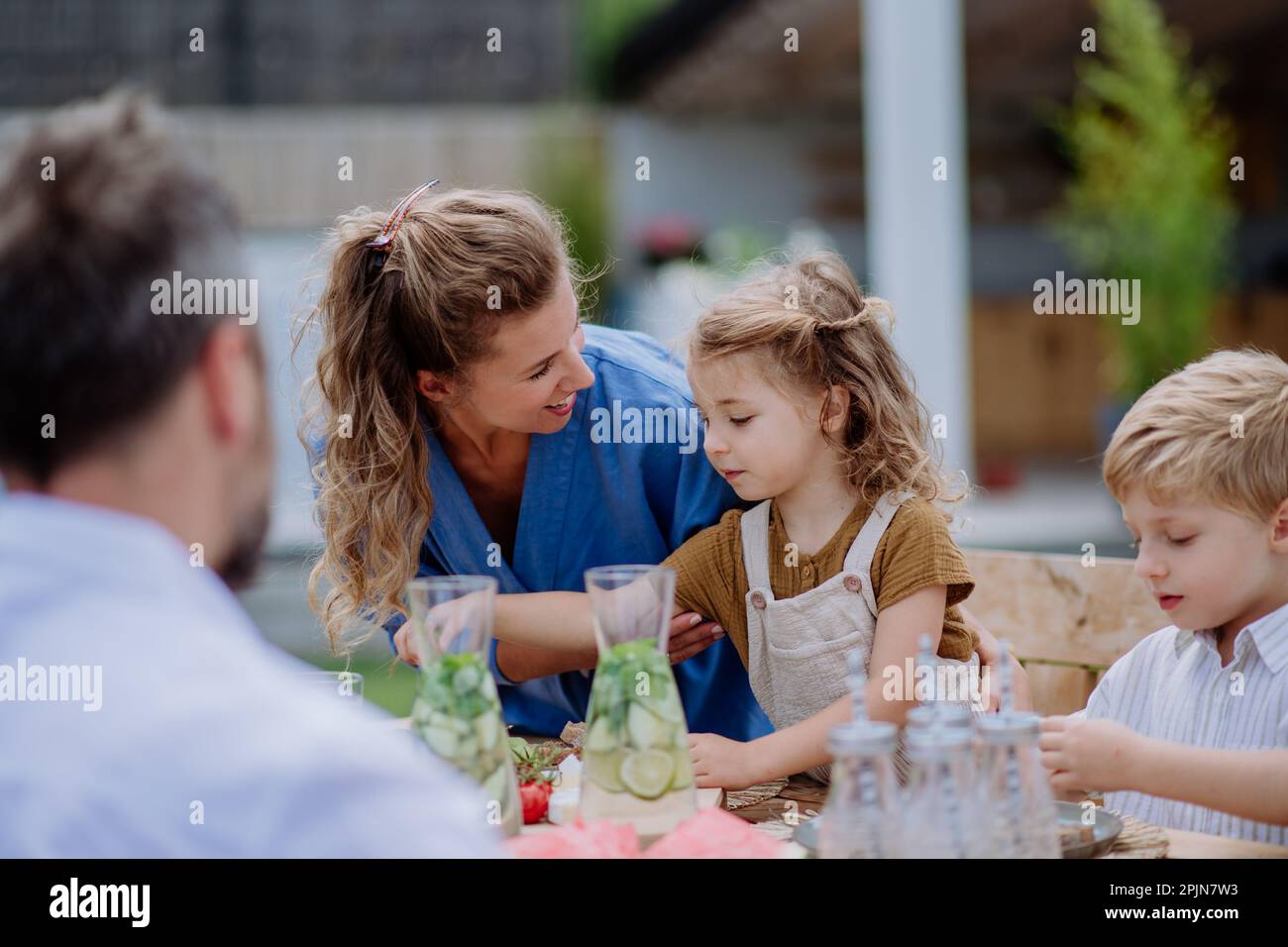 Multi generation family having outdoor garden party Stock Photo - Alamy