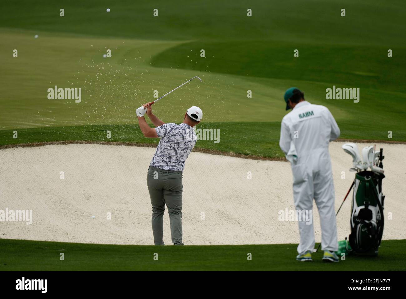 Jon Rahm, of Spain, works out on the range during a practice for the ...