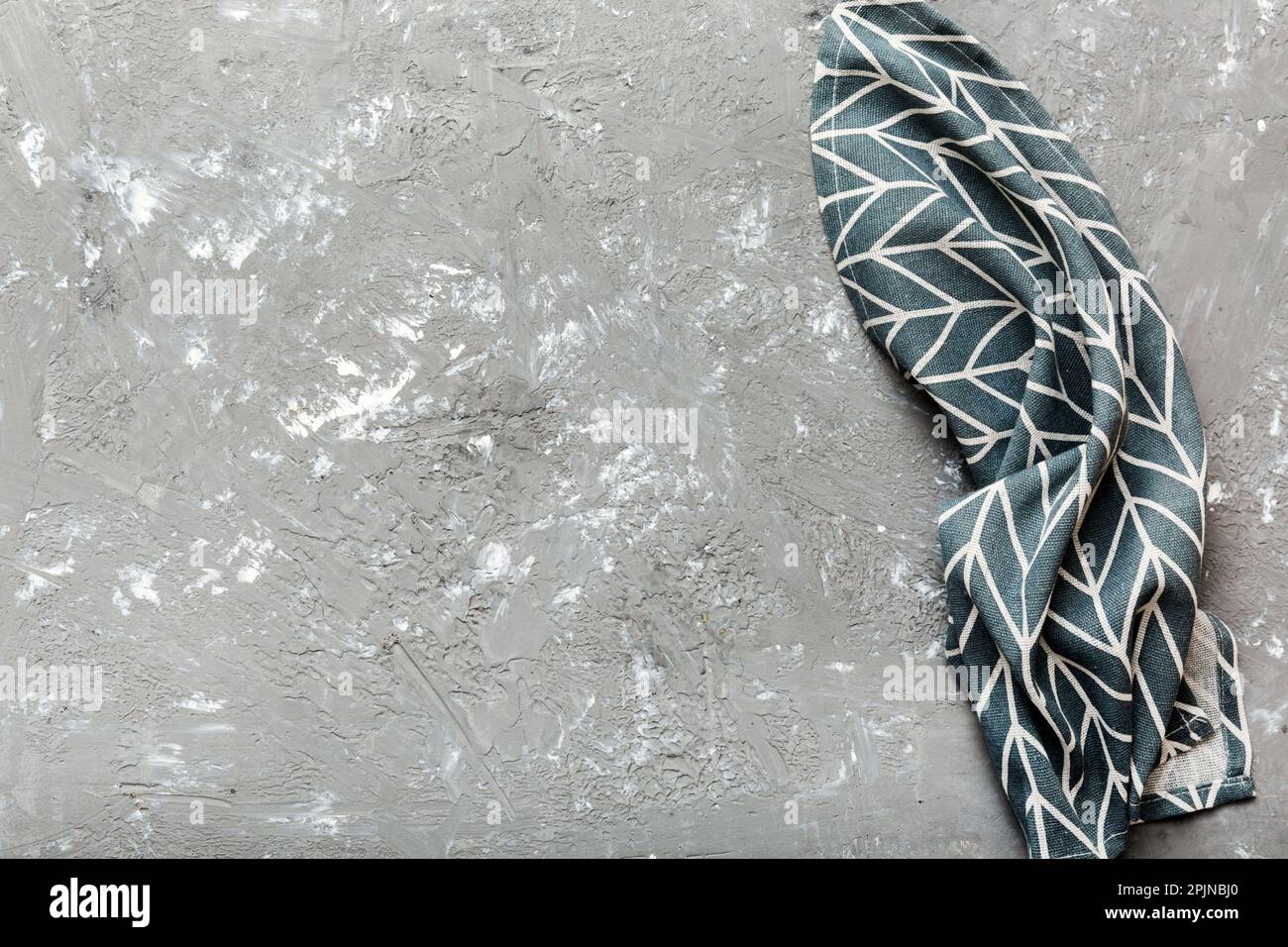 top view with blue kitchen napkin isolated on table background. Folded ...