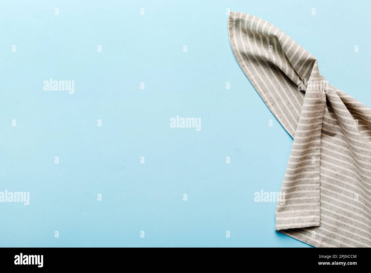 top view with gray kitchen napkin isolated on table background. Folded ...