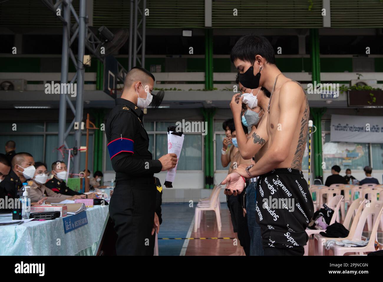 A young man gets a physical examination during a military conscription call-up at Wat Phai Tan ...
