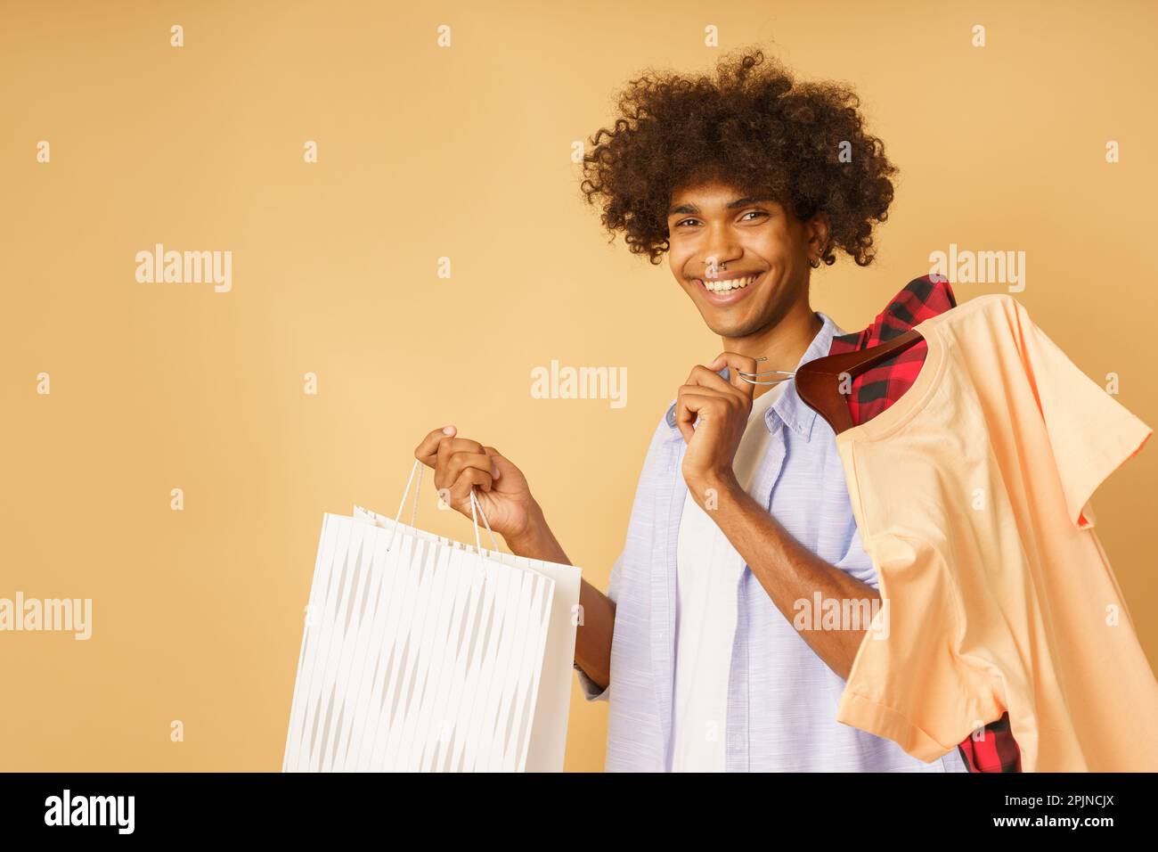 Happy happy man buy clothes on a store Stock Photo - Alamy