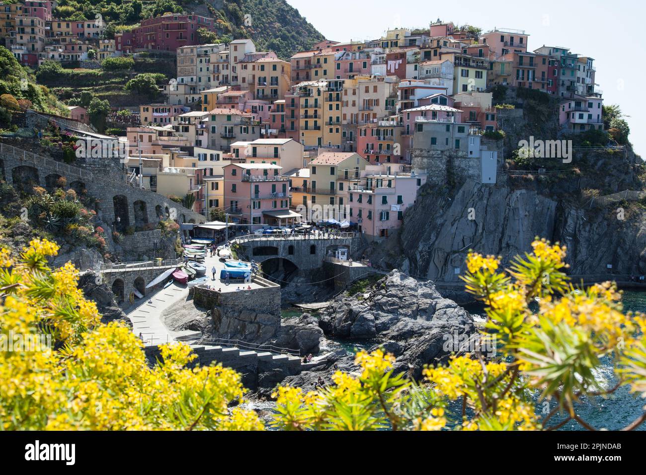 Colourful houses are crammed together on the cliffs of Manarola village ...