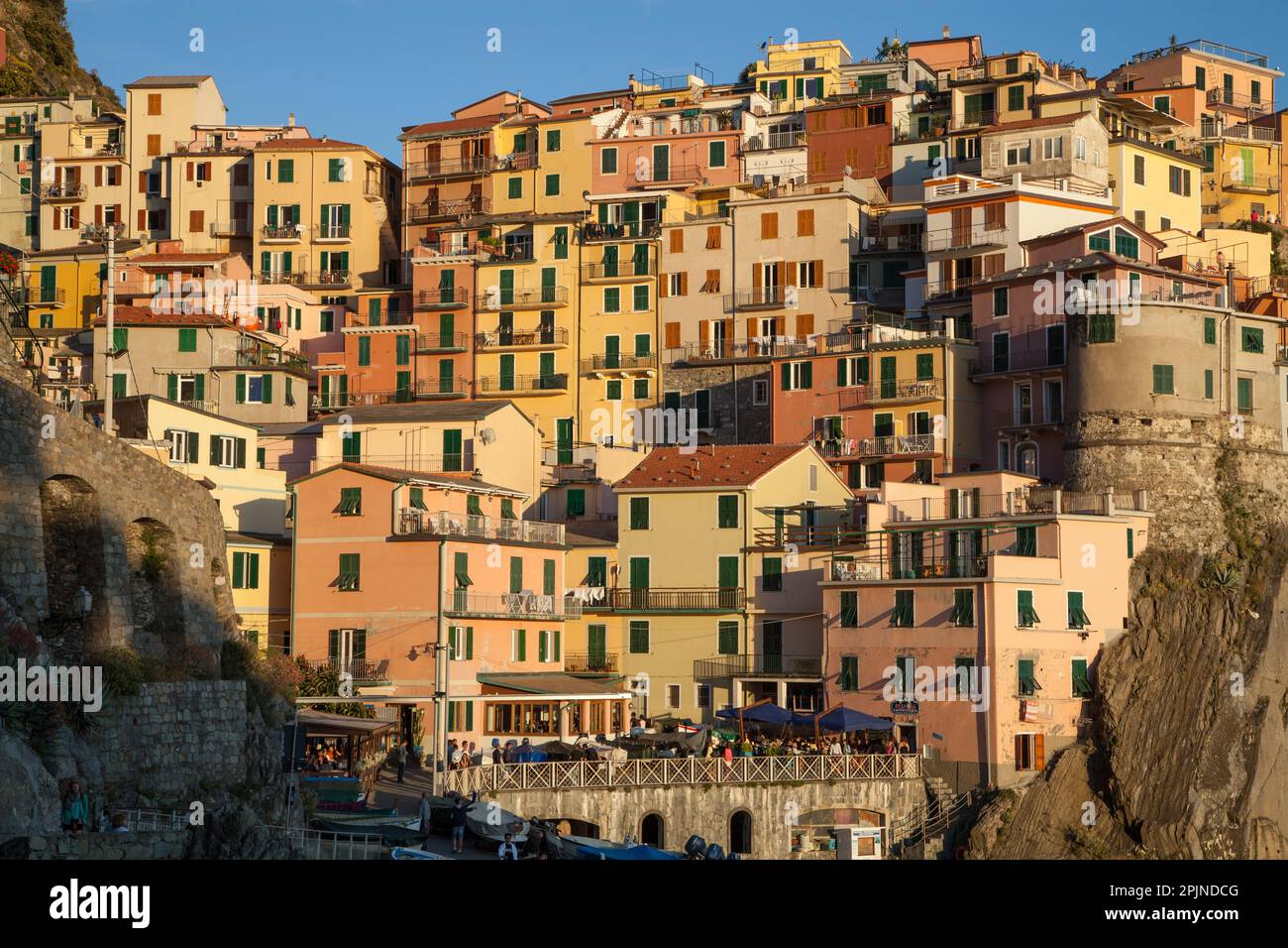 Colourful houses are crammed together on the cliffs of Manarola village ...
