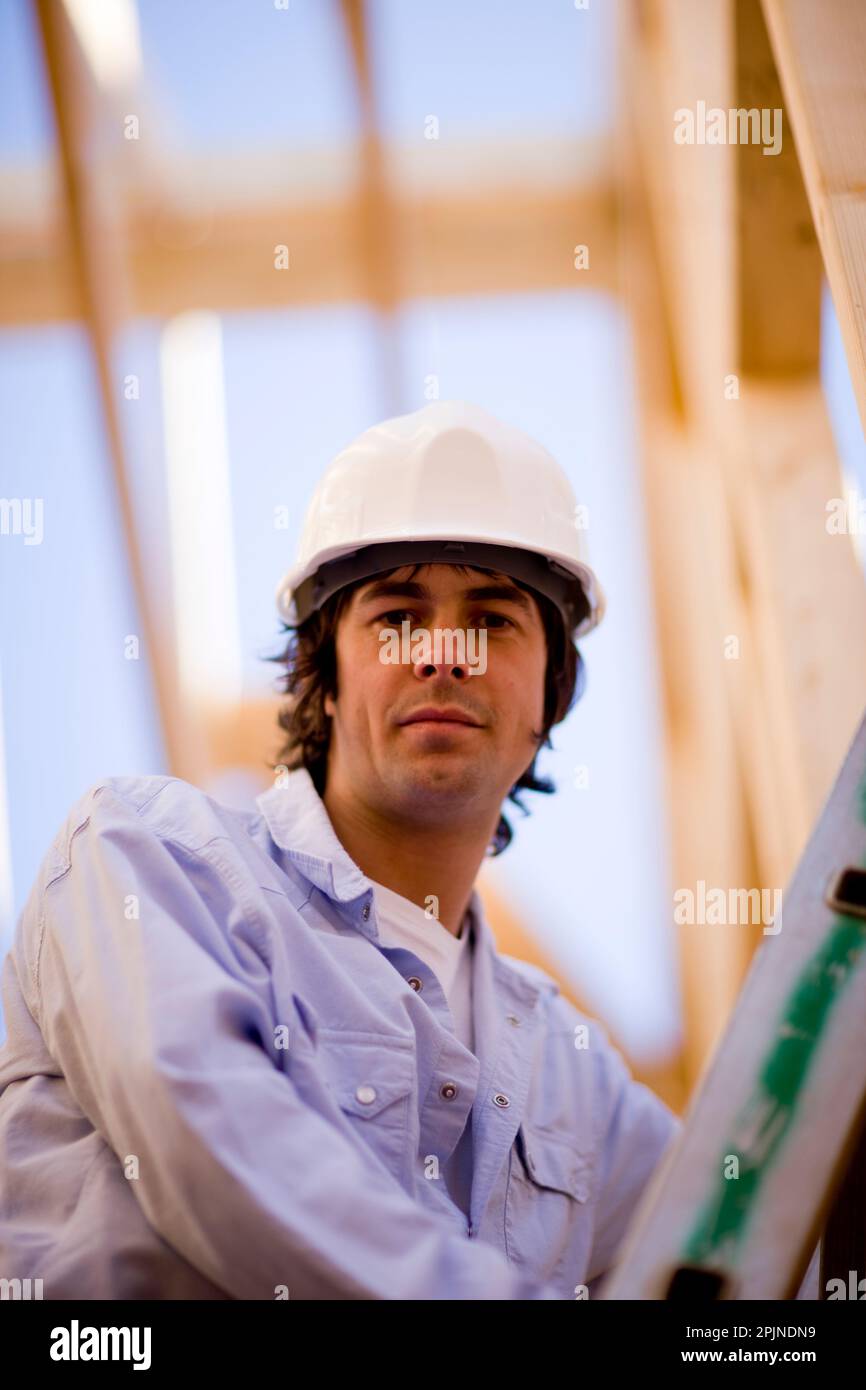 Construction climbing ladder up roof hi-res stock photography and ...