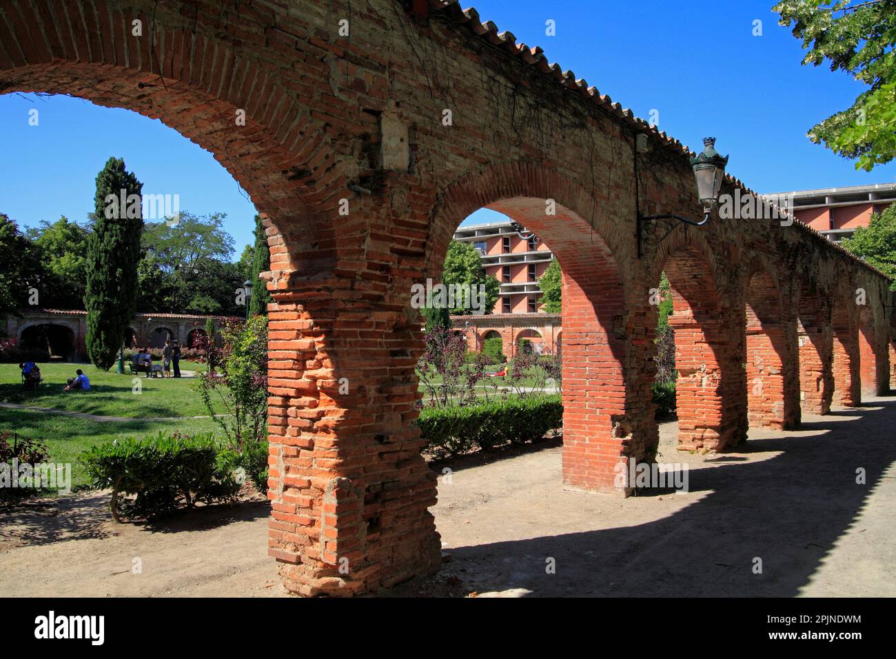 The garden and the Cloister of the Chartreux. Red brick arches. Remains ...
