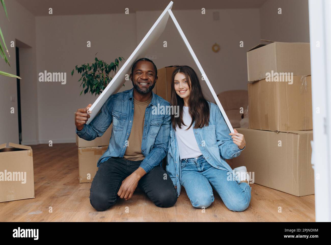 a couple moves into their own house, together they make a gesture of ...