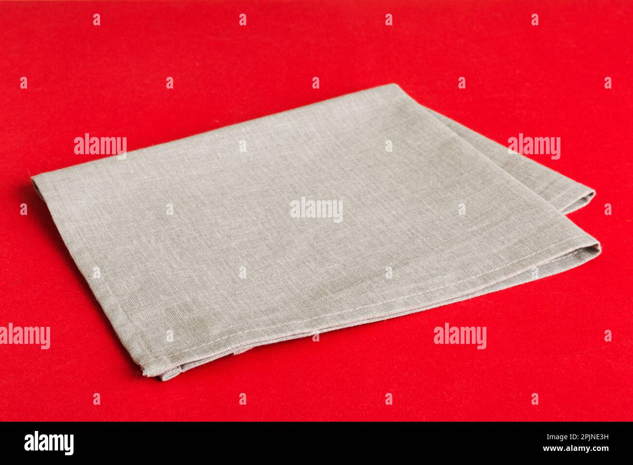 top view with gray kitchen napkin isolated on table background. Folded ...