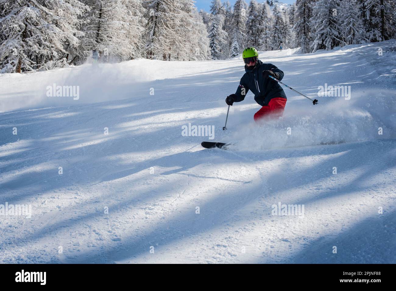 Skier turning on powder snow hi-res stock photography and images - Alamy