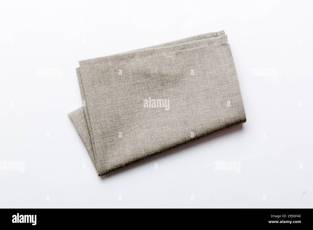 top view with gray kitchen napkin isolated on table background. Folded ...
