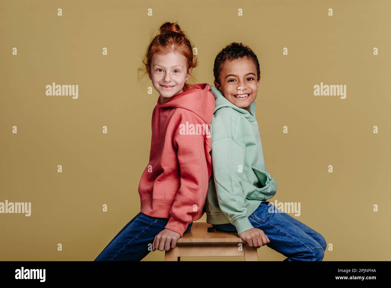 Boy with his friend posing during studio shoot Stock Photo - Alamy
