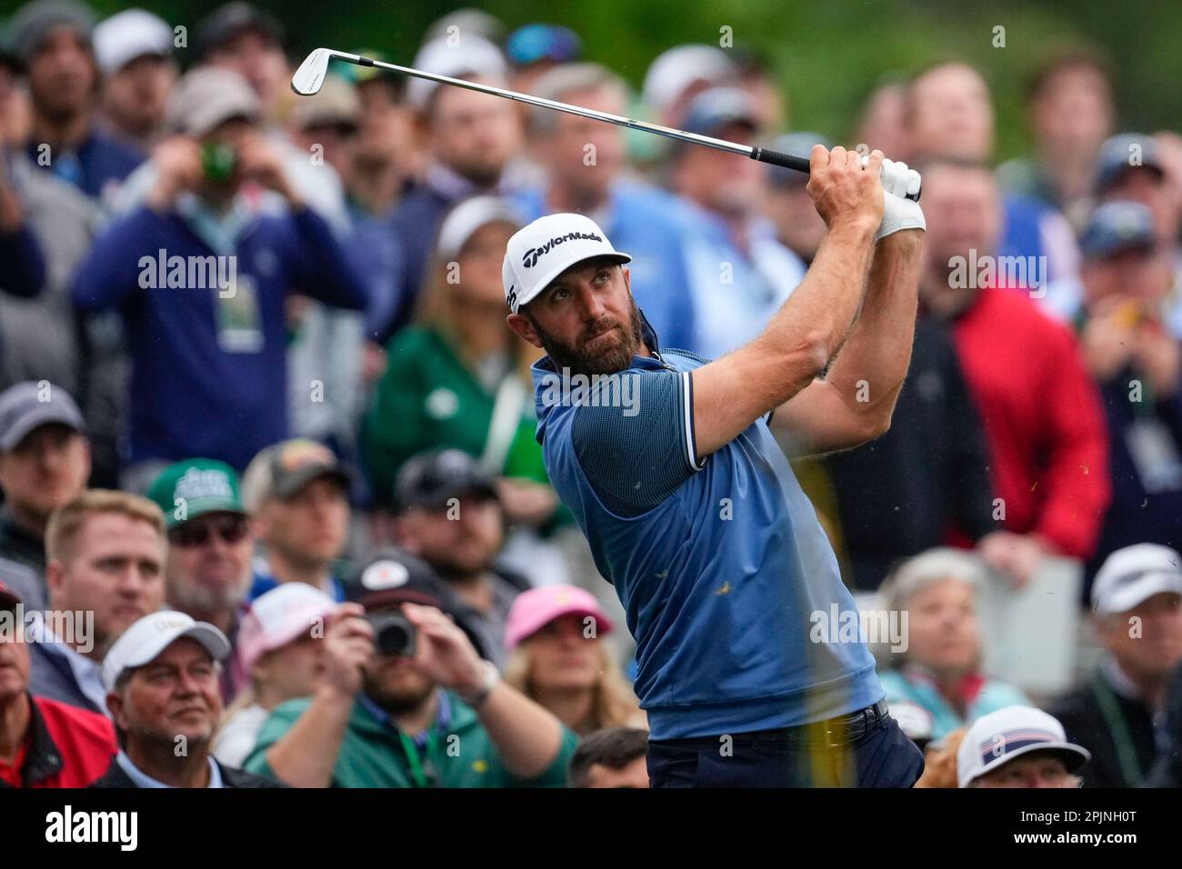 Dustin Johnson hits on the 12th fairway during a practice for the ...