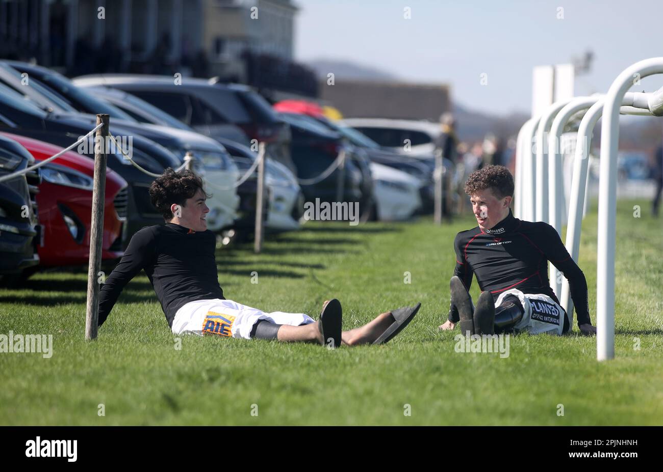 Jockeys Toby McCain-Mitchell (left) and Jay Tidball relax between races ...