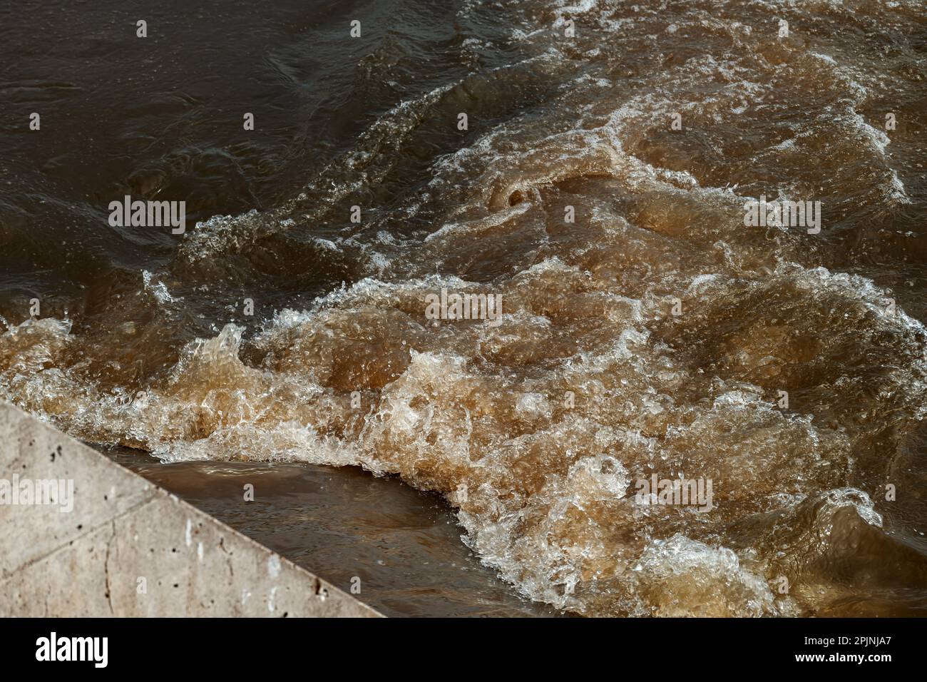 Sewage pipe outfall into the river, water pollution and environmental ...