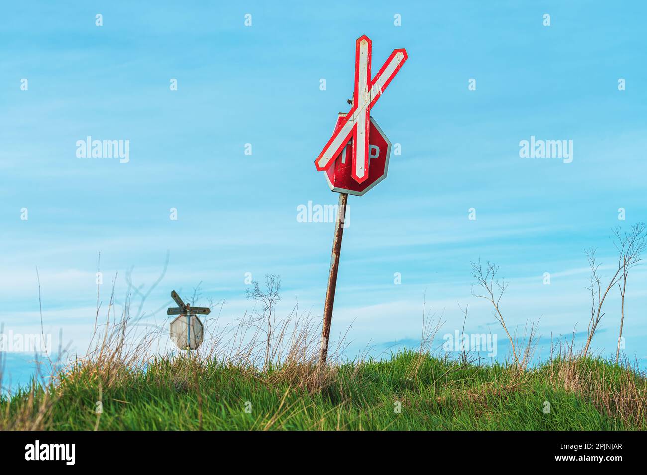 St Andrew's Cross and stop sign at railroad level crossing in ...