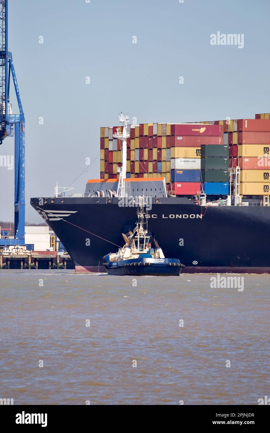 Tugboat Svitzer Deben assisting a container ship at the Port of ...