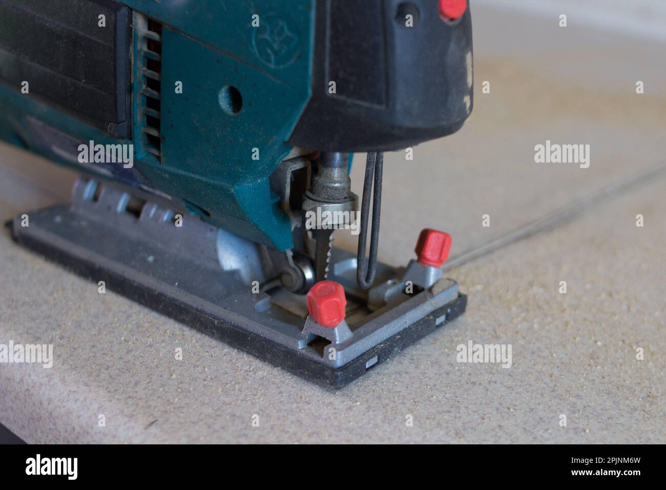 working with electric jigsaw for cutting out parts Stock Photo - Alamy