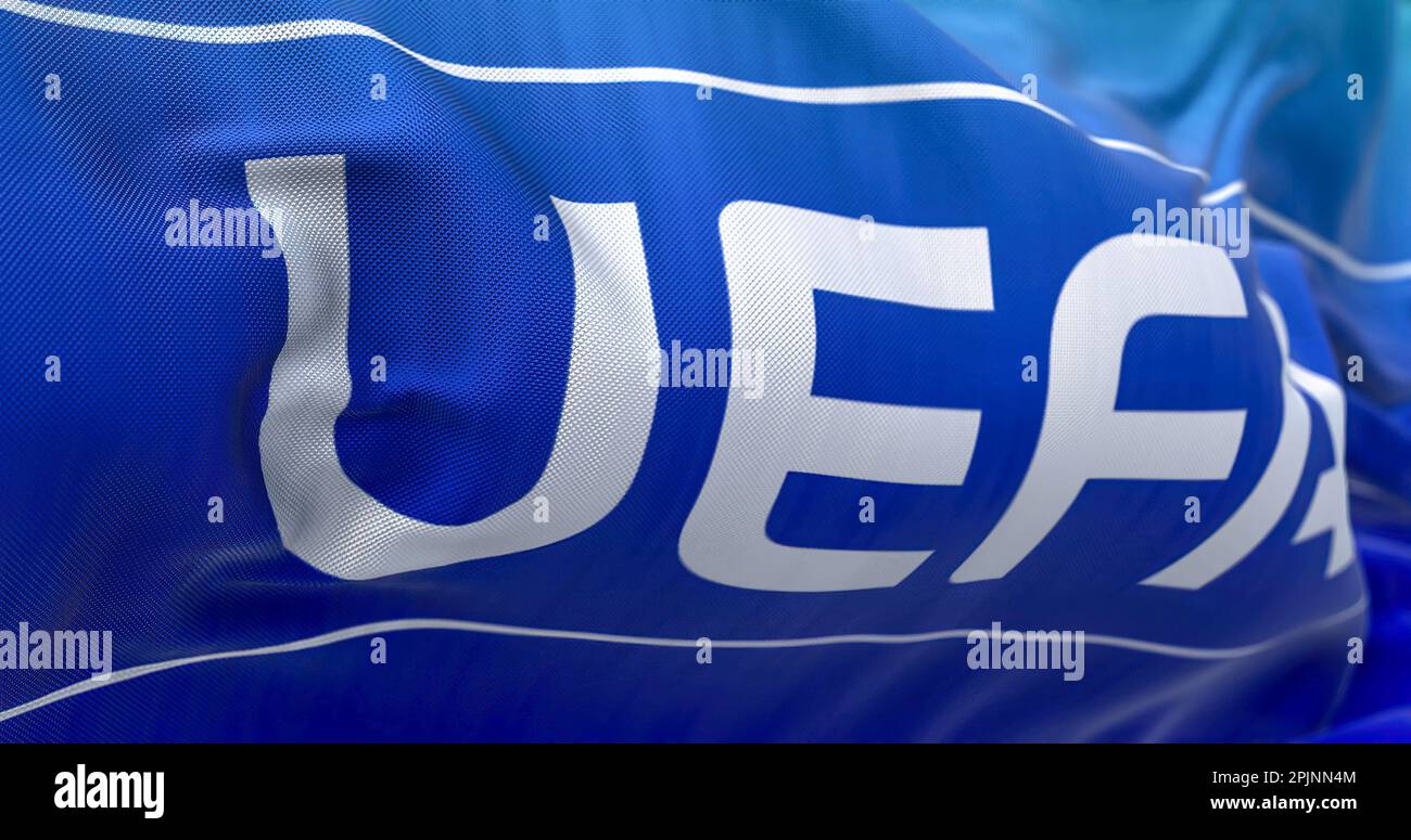 Nyon, CH, September 2022: flag with the UEFA logo waving in the wind ...