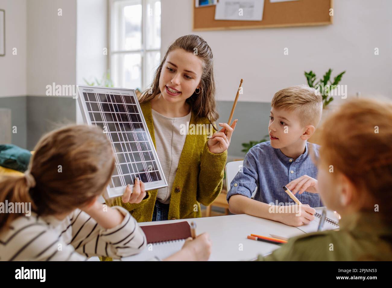Young teacher with solar panel learning pupils about solar energy Stock ...
