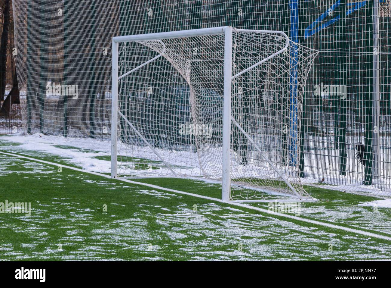 field for playing football in winter, artificial grass on cleared of ...