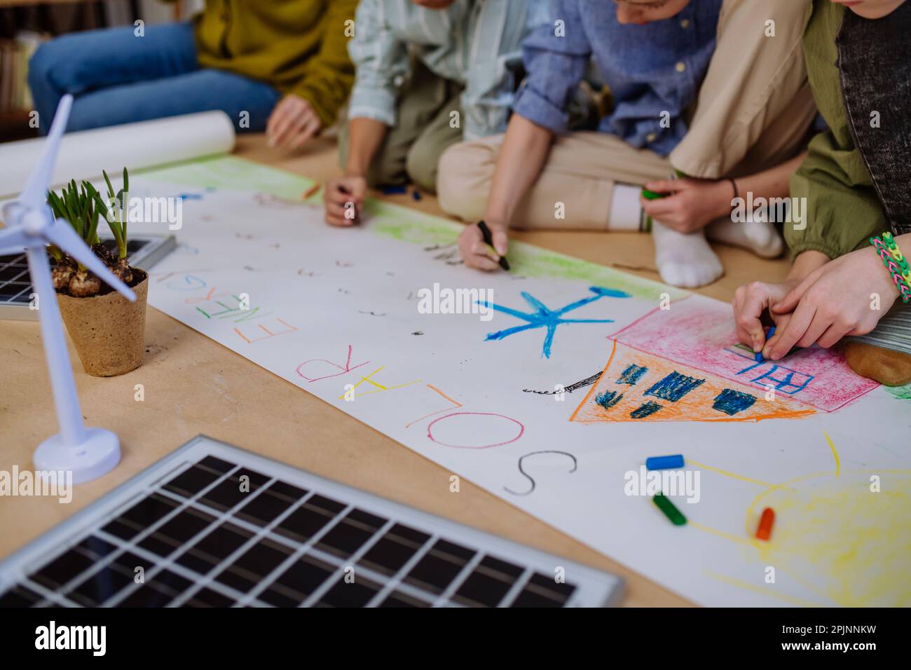 Children drawing a project to environmental lesson Stock Photo - Alamy