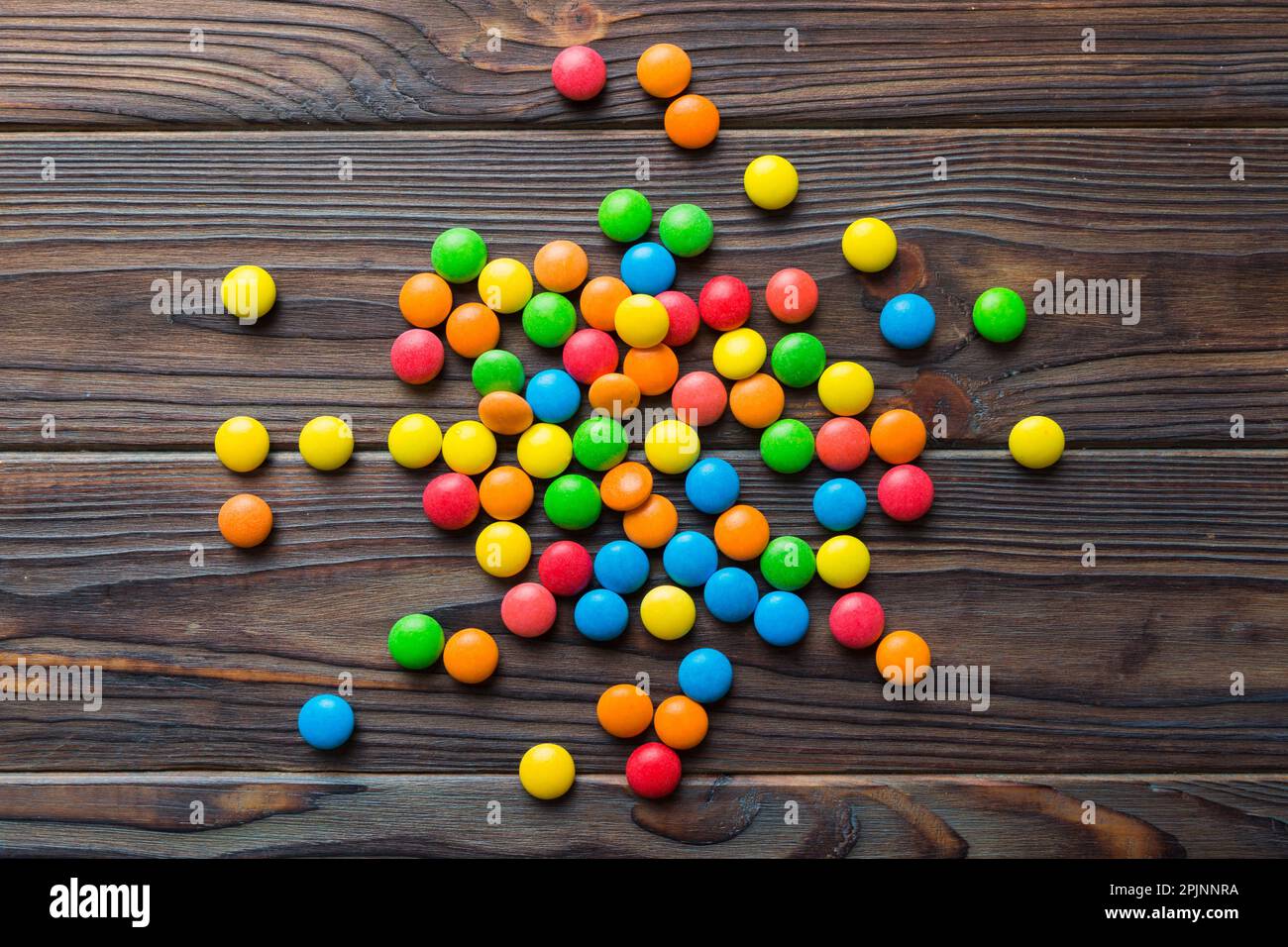 Mixed collection of colorful candy, on colored background. Flat lay ...