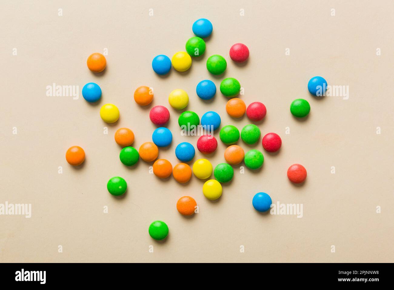 Mixed collection of colorful candy, on colored background. Flat lay ...
