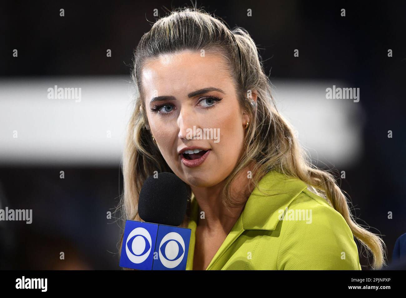 CBS and Paramount television reporter Poppy Miller holds a microphone ...