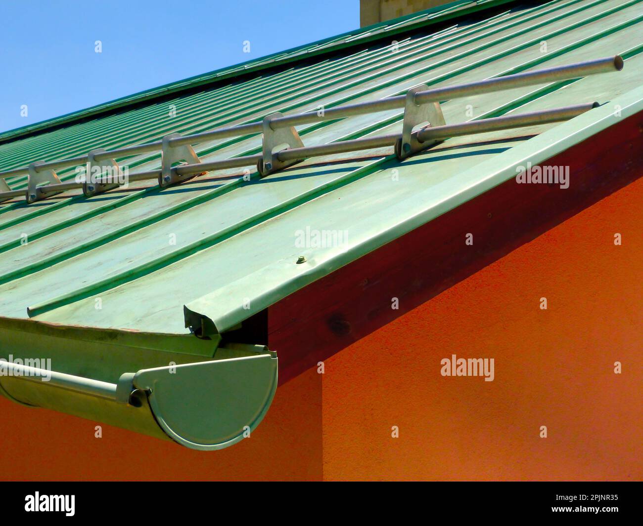 aged green weathered copper plate sloped roof. vertical seams. aluminum ...