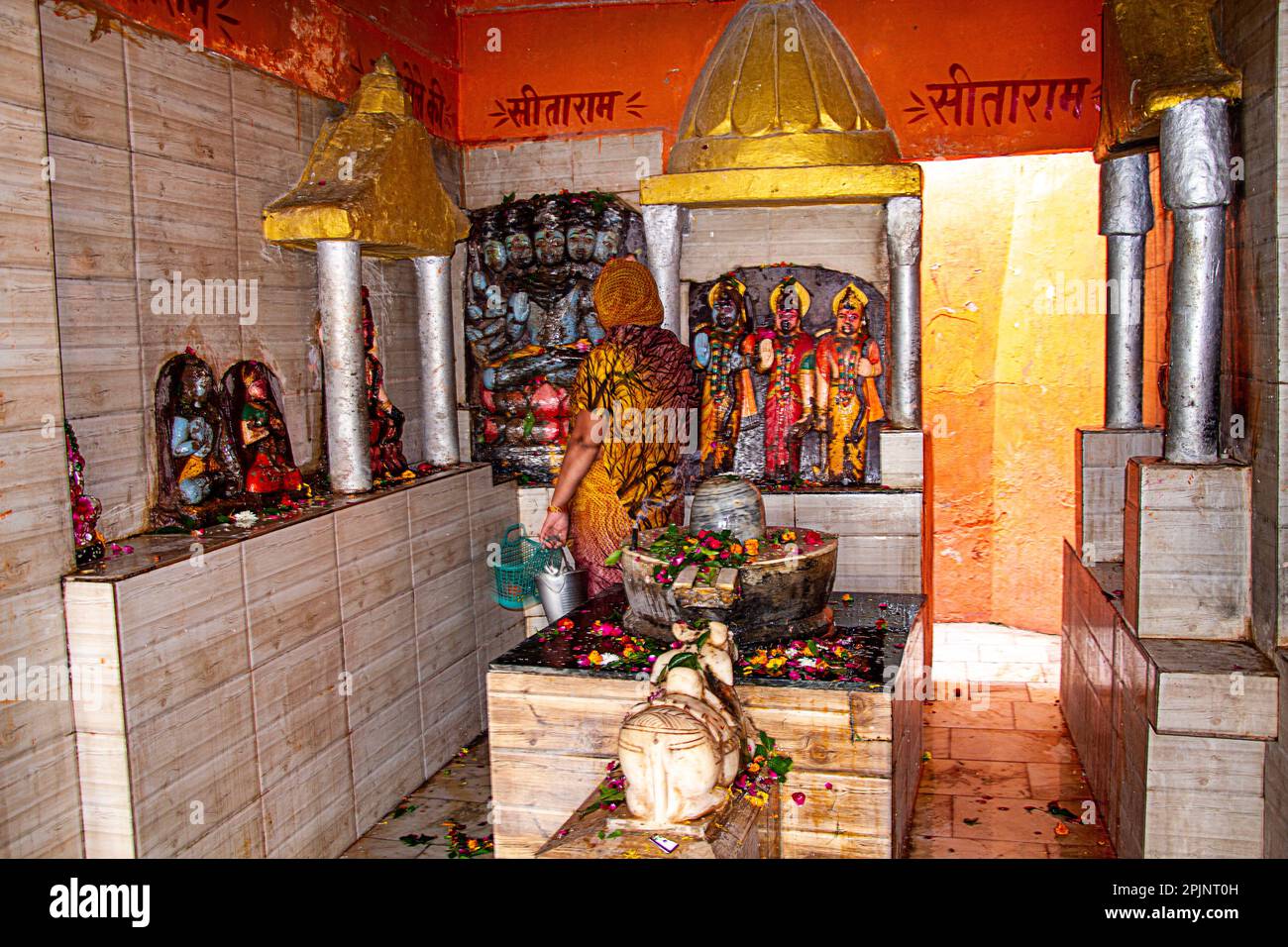 Devotee praying to Gods in a temple Stock Photo - Alamy