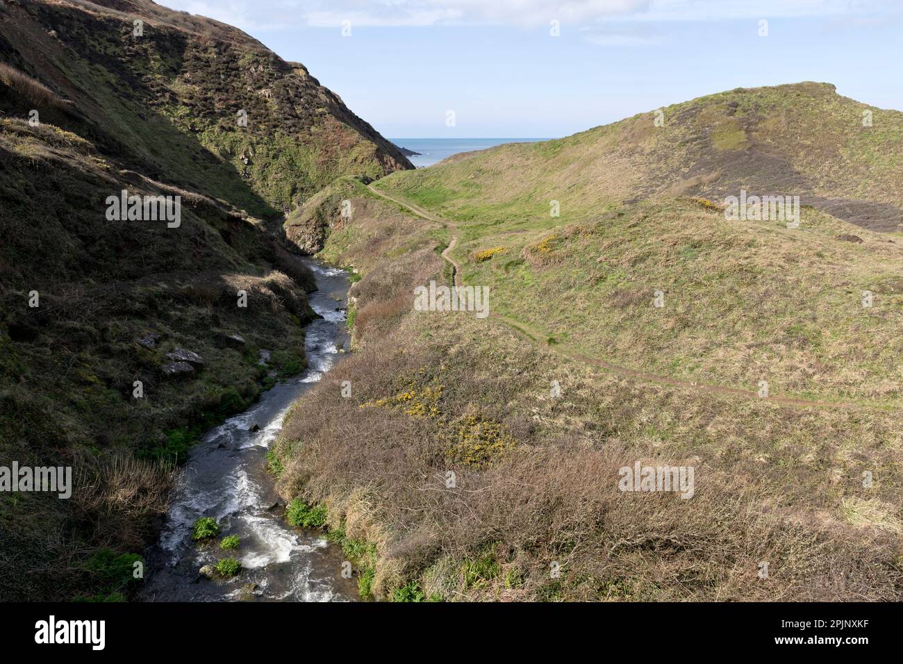 Devon-Cornwall border Marsland Mouth on the South West Coast Path Stock ...