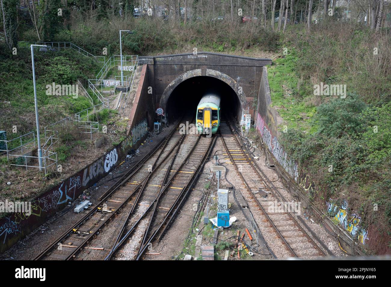 An aerial view of a Southern Railway train exiting the tunnel at ...
