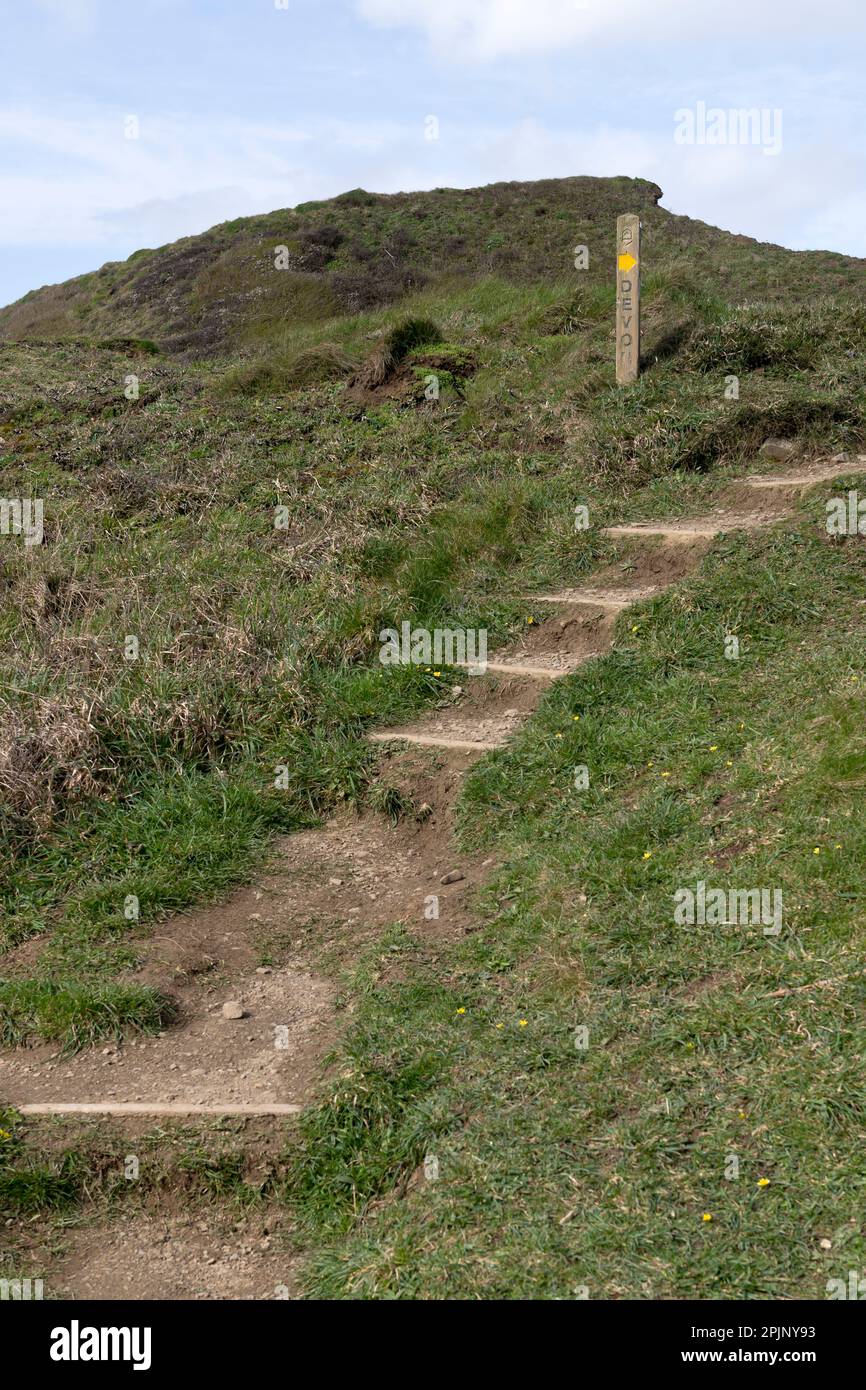 Devon-Cornwall border Marsland Mouth on the South West Coast Path Stock ...