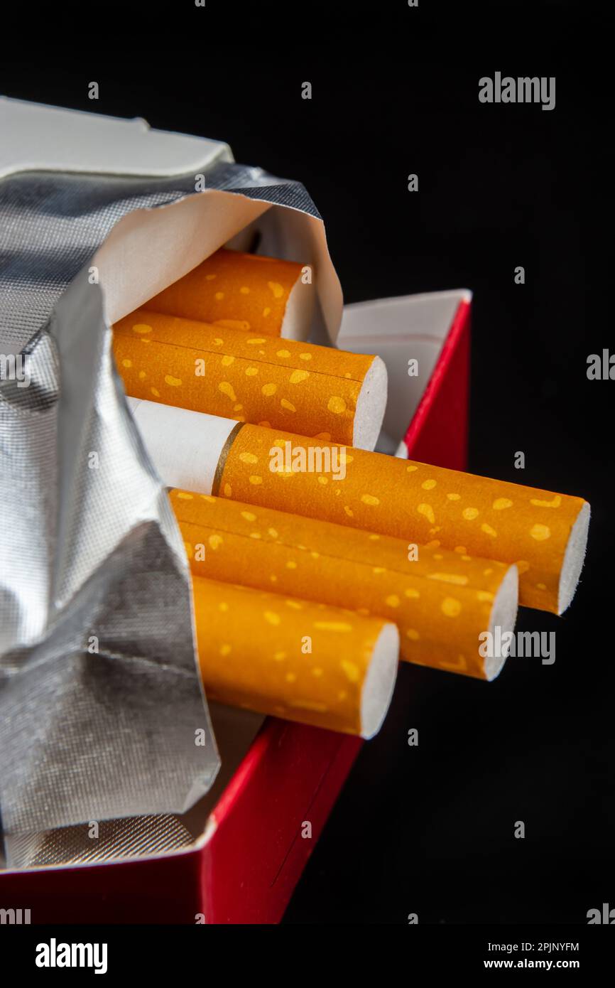 Close up cigarette in pack is addictive to be cancer.smoking reduction ...