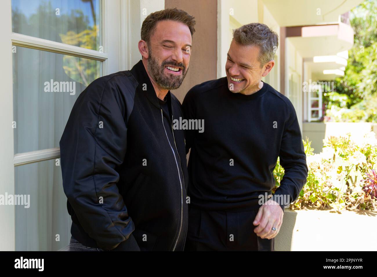 Ben Affleck, left, and Matt Damon laugh as they pose for a portrait to ...