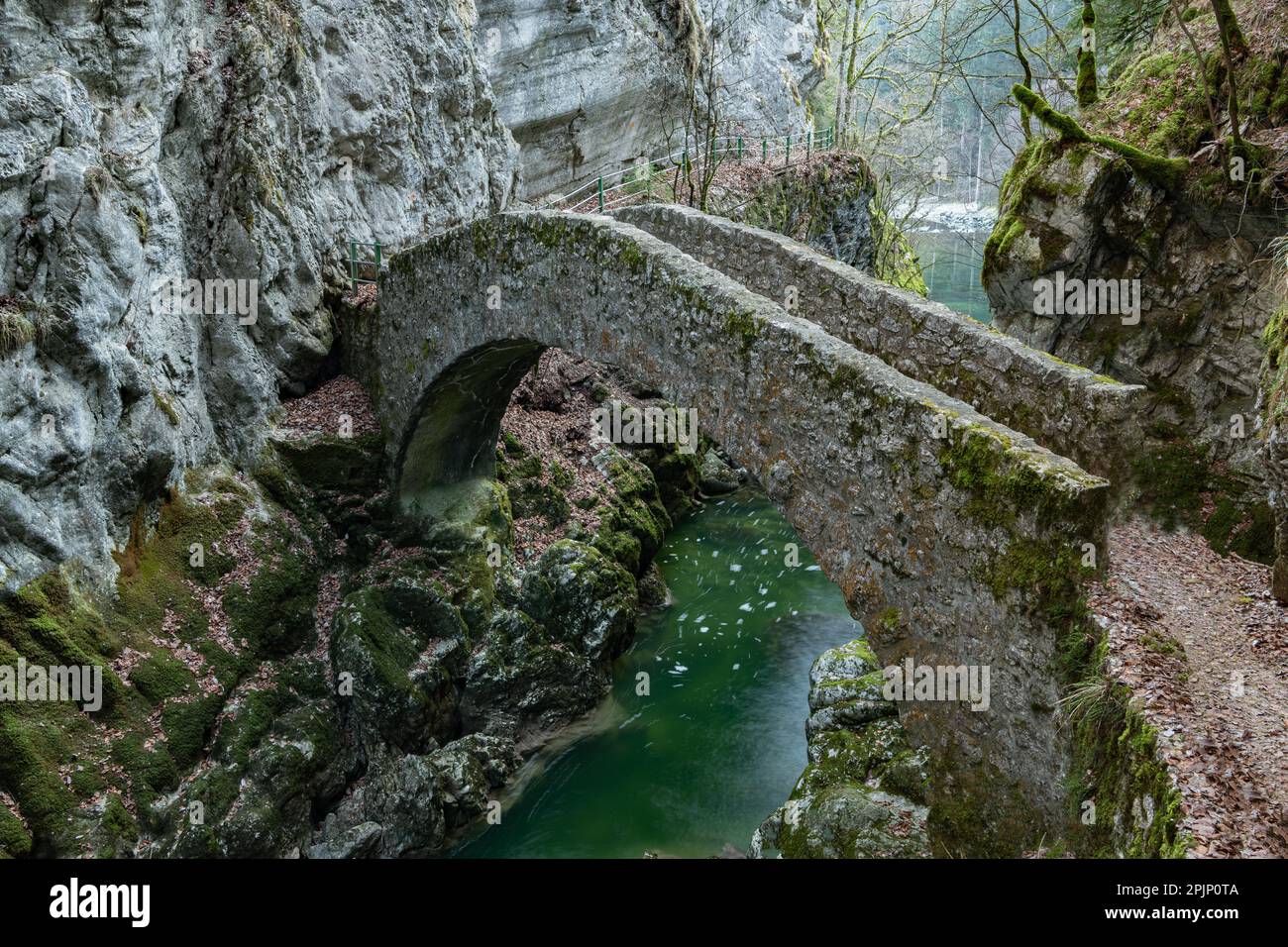 A picturesque rocky bridge across Gorges de l'Areuses, Romandie Stock ...