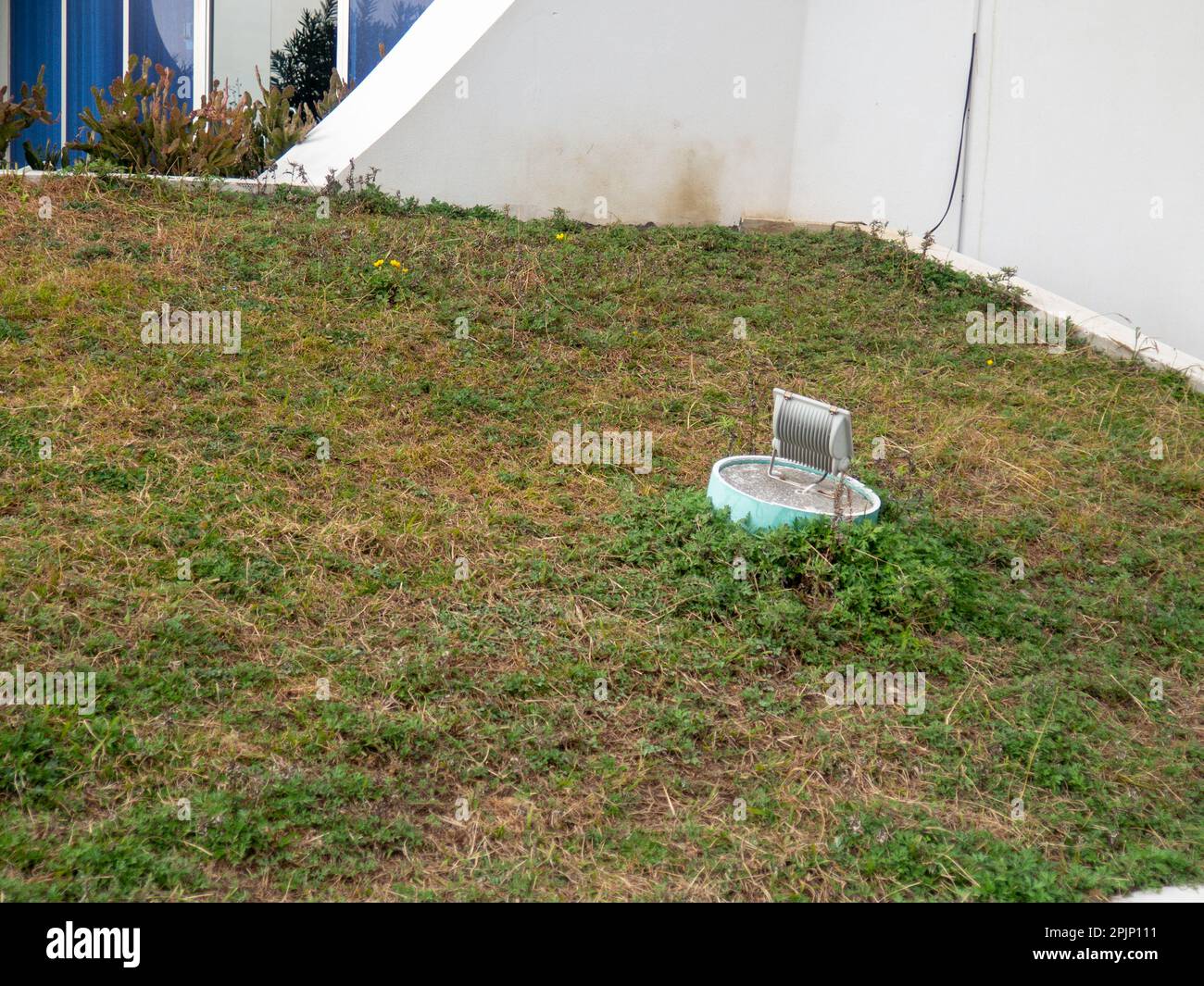 Lamp to illuminate the building on the lawn. Spotlight. Switched off ...