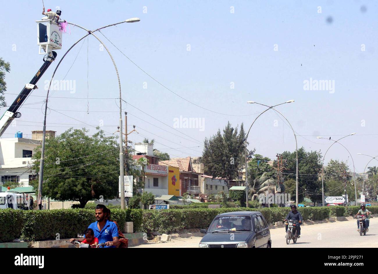 Karachi, Pakistan, April 3, 2023. Technicians are busy in repairing ...